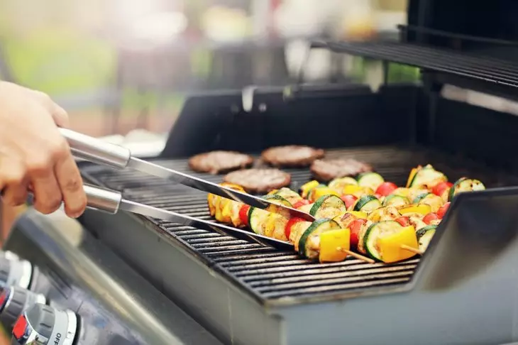 Skewers of veggies on grill.